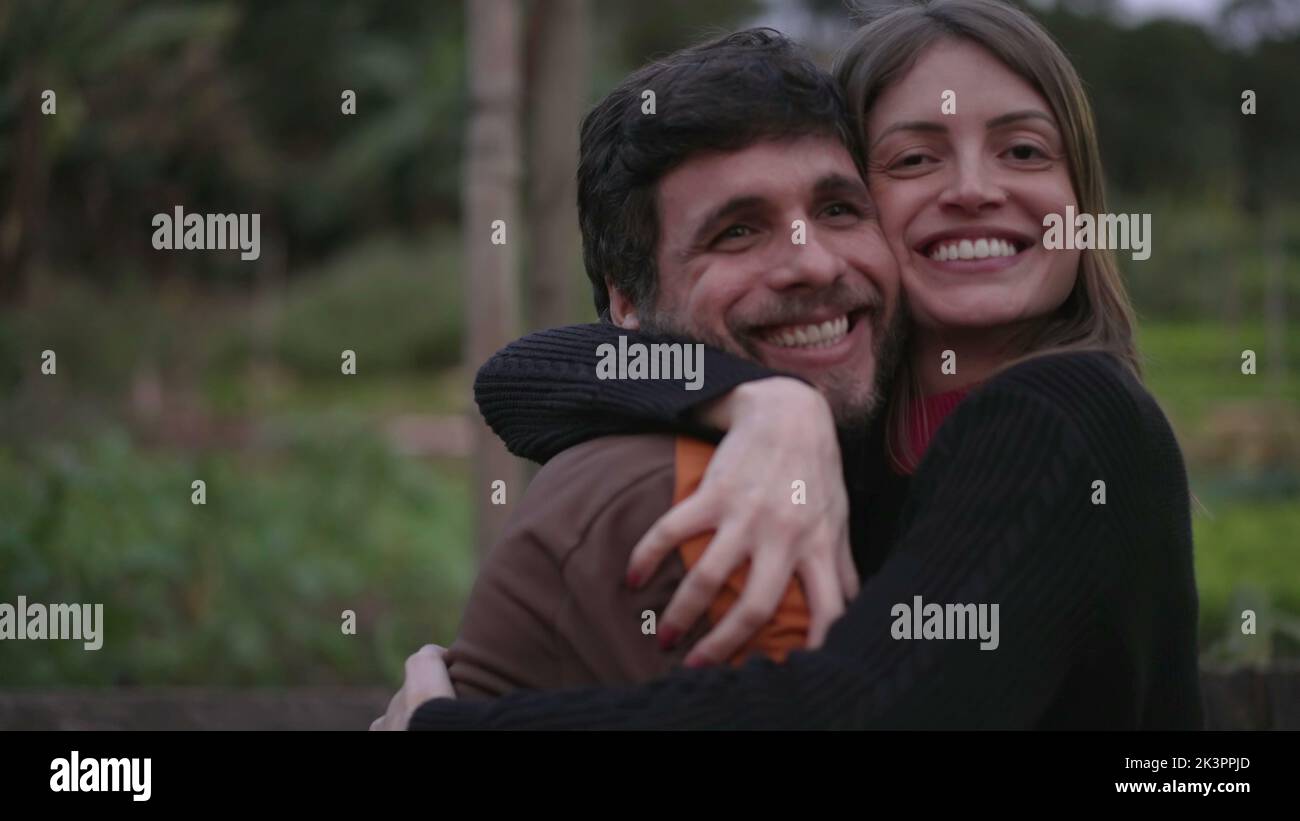 Two friends embrace. male and female people hugging each other at night ...