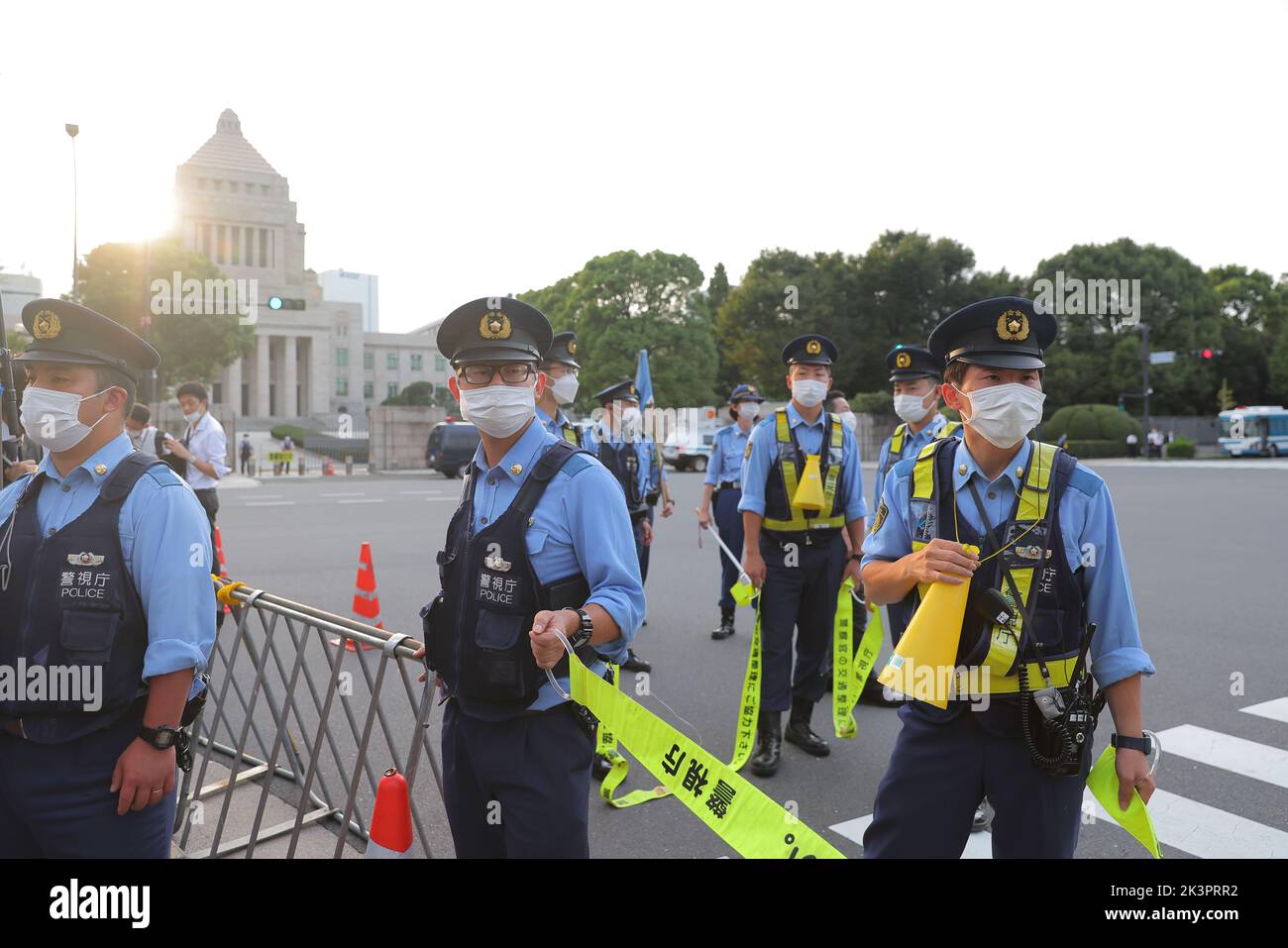 Police officers control traffic and pedestrian crossing in front of the ...
