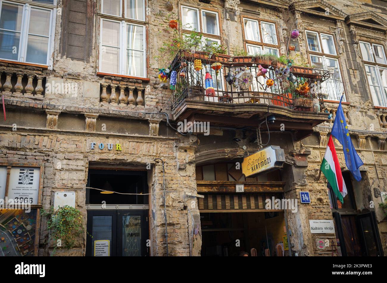 The front of Szimpla Kert Ruin Bar in Budapest, Hungary with flags and ...