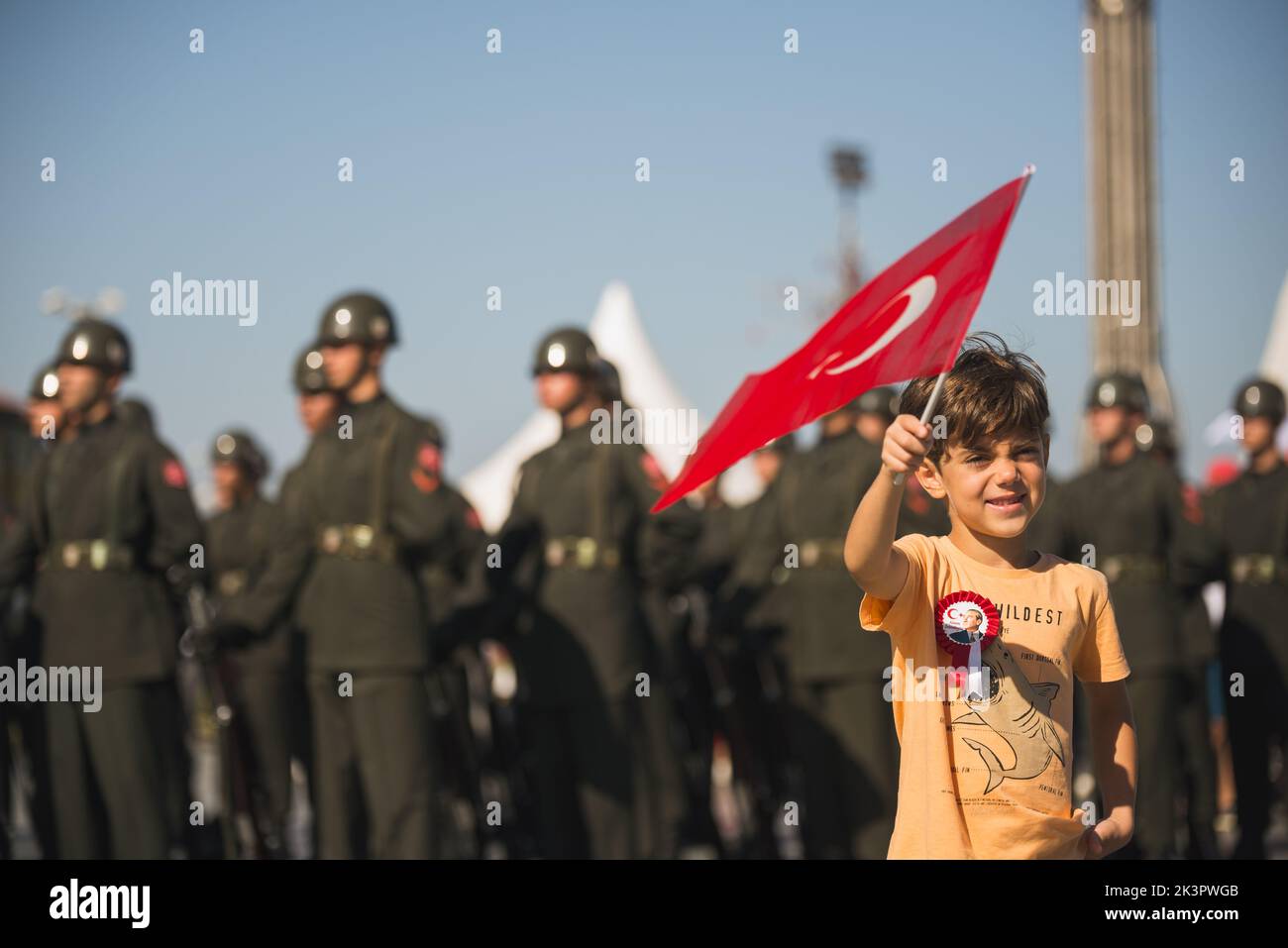 Izmir, Turkey - September 9, 2022: A child with a Turkish flag in front ...