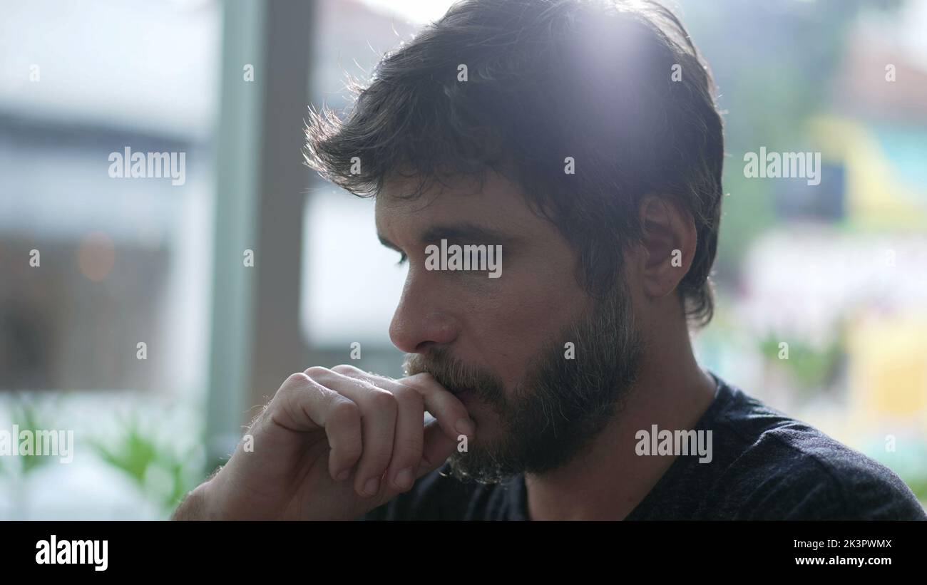 Thoughtful man thinking solution. One pensive person pondering solving ...