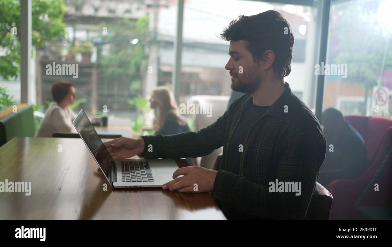 Young entrepreneur or worker opening laptop computer working remotely ...