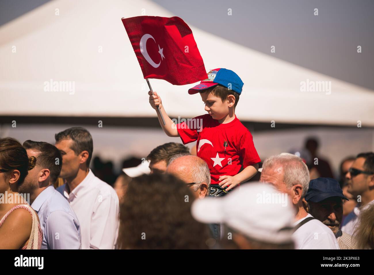Izmir, Turkey - September 9, 2022: A boy with a Turkish flag and t ...