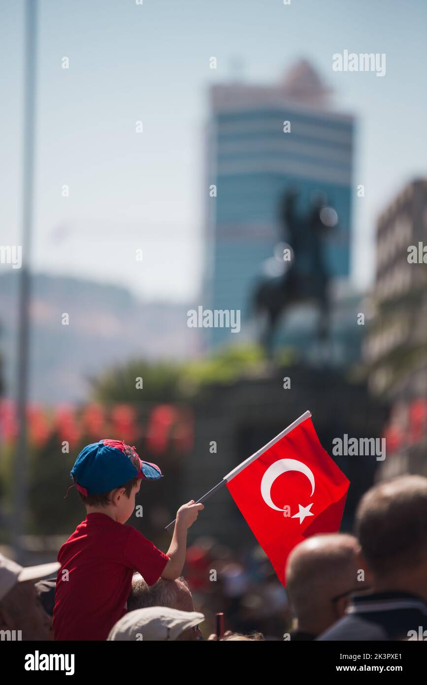 Izmir, Turkey - September 9, 2022: A boy with a Turkish flag and t ...
