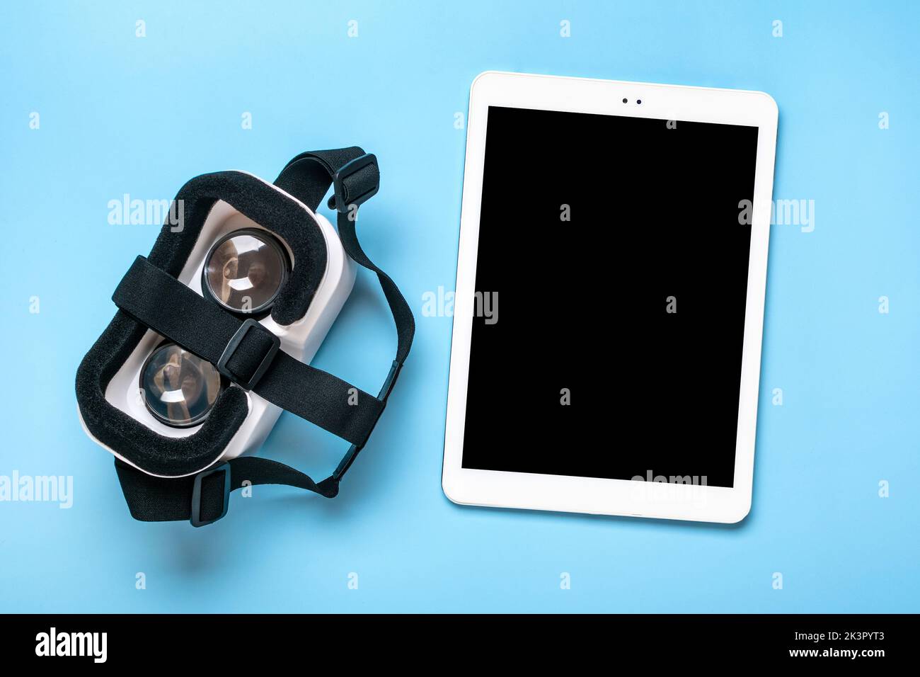 white tablet with black screen display, vr glasses for virtual reality ...