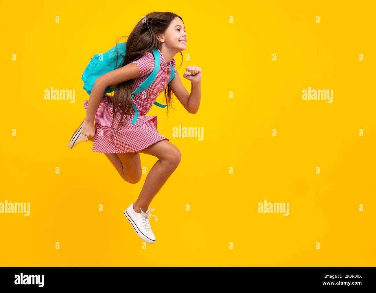 Back to school. Teenage school girl ready to learn. Crazy run and jump ...