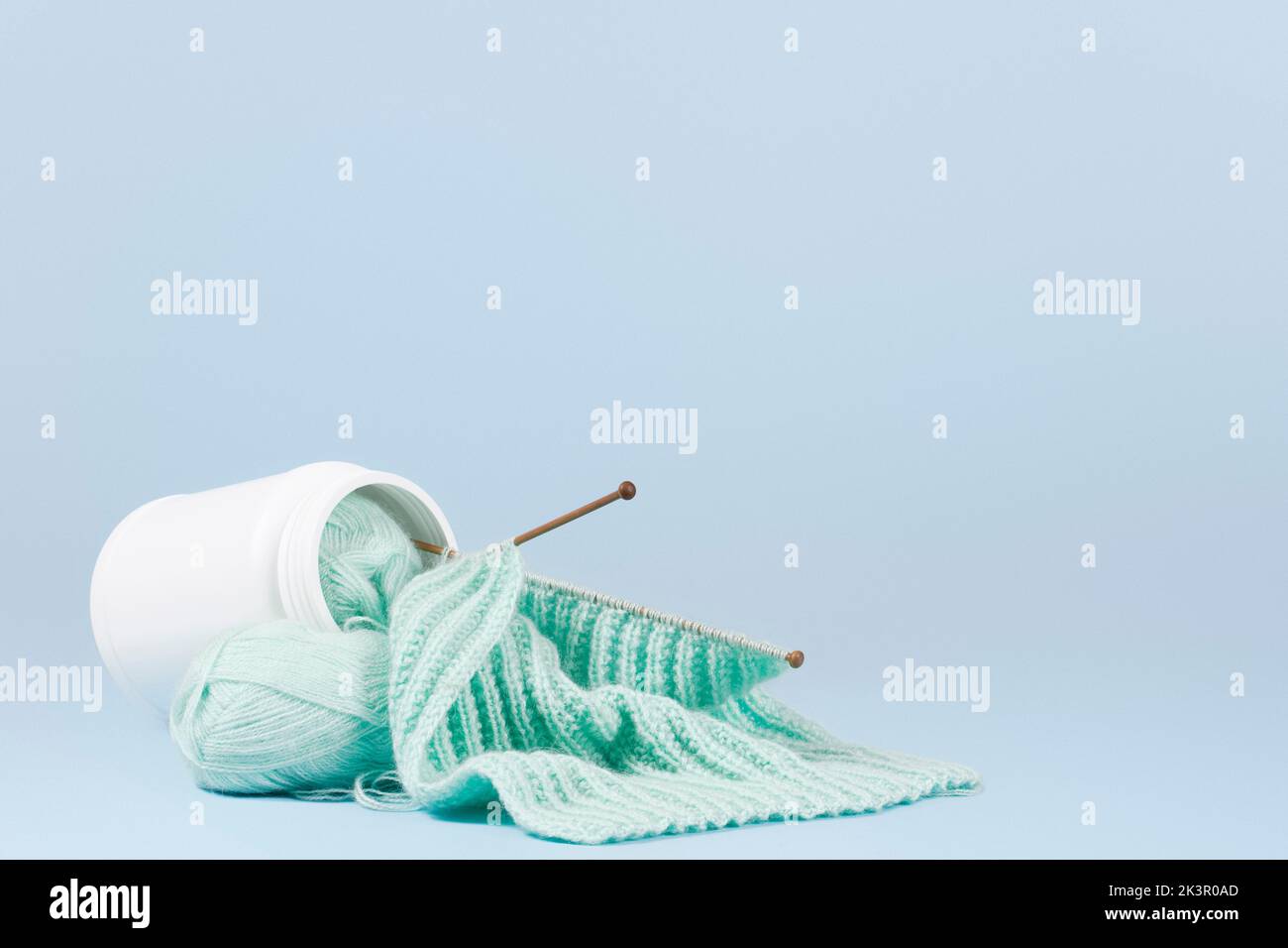 Knitting as therapy. Supplement bottle with yarn balls and green ...