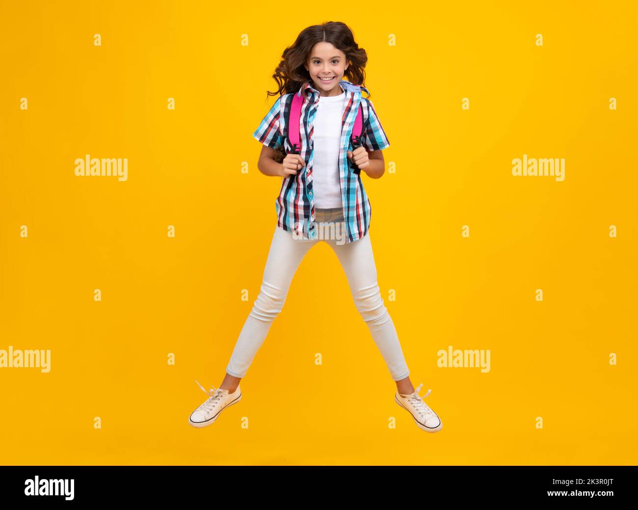 Back to school. Teenage school girl ready to learn. Crazy run and jump ...