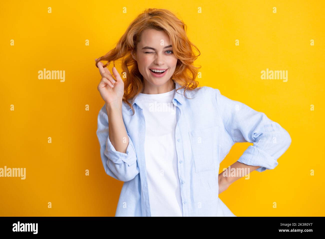 Redhead woman winks portrait. Beautiful redhead woman smiles cheerfully ...