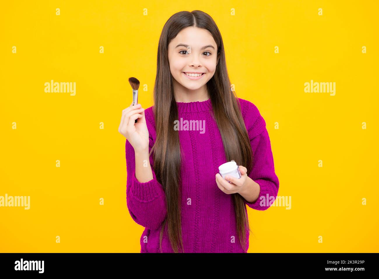 Beautiful portrait of teen girl child artist apply powder with make up ...