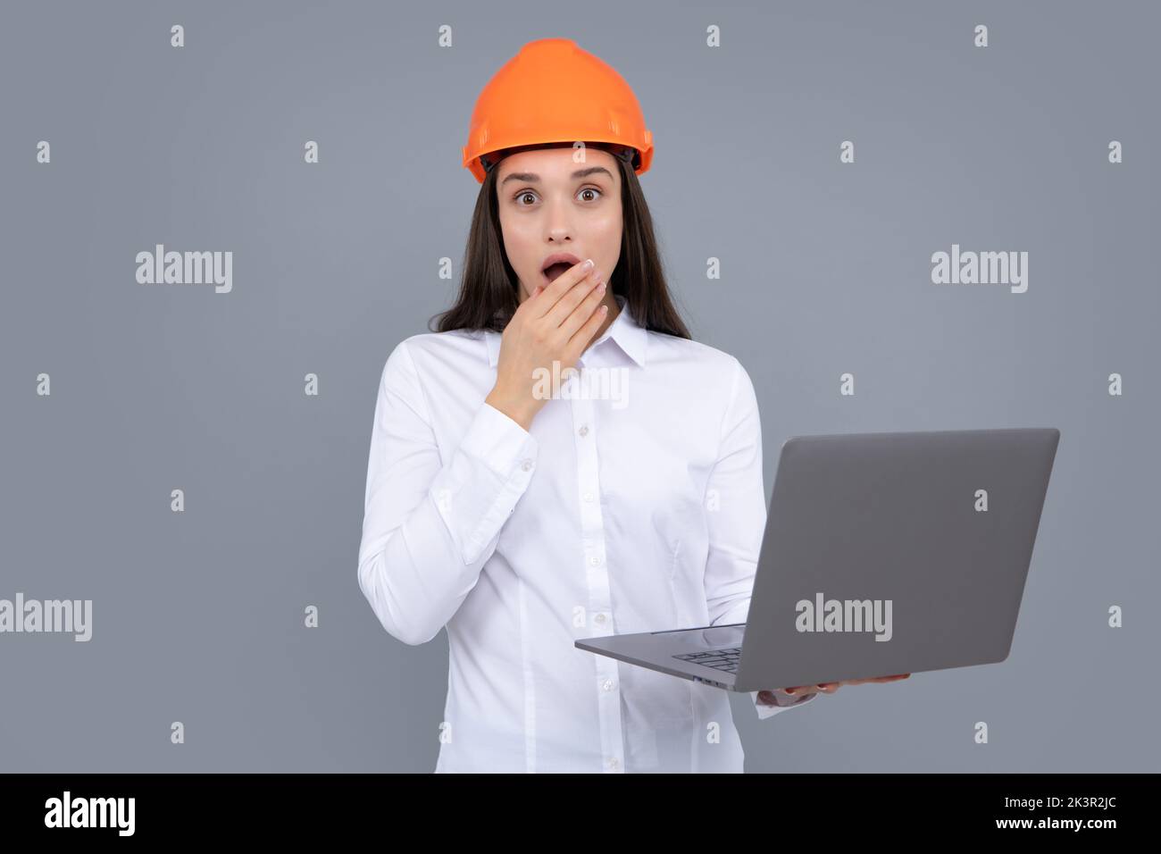 Surprised shocked excited business woman with laptop computer, portrait ...
