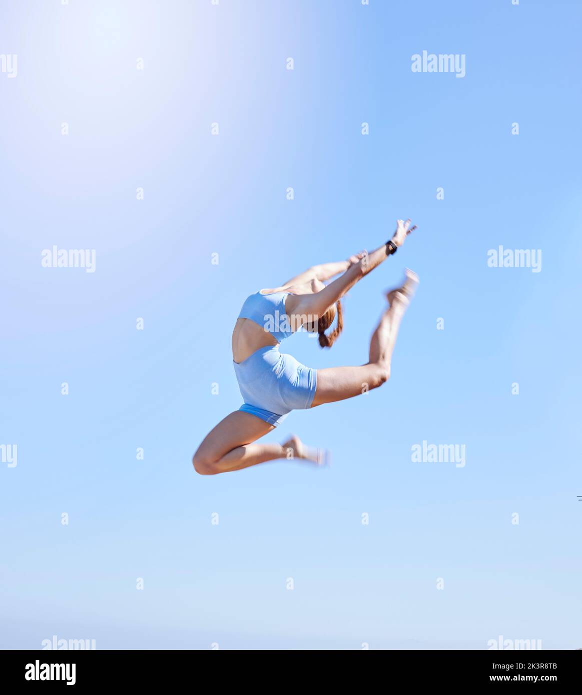 Fitness, jumping and sky with a sports woman mid air outdoor against a ...