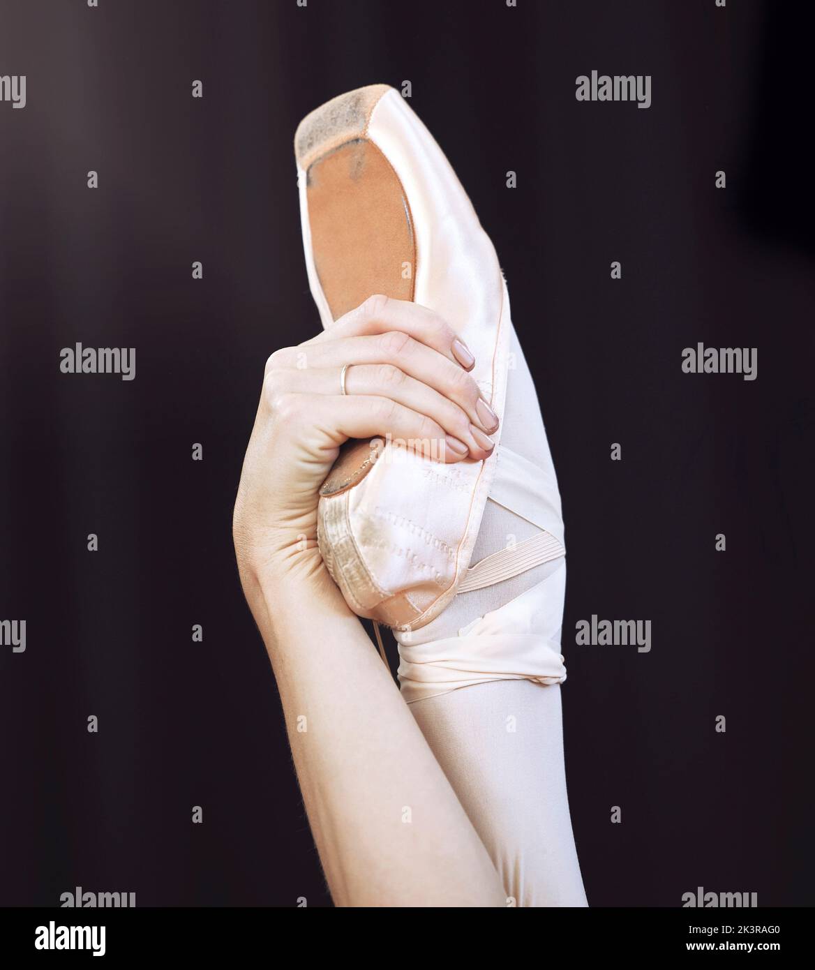 Dancer hand and foot on ballet shoe and hand, show posture and balance ...