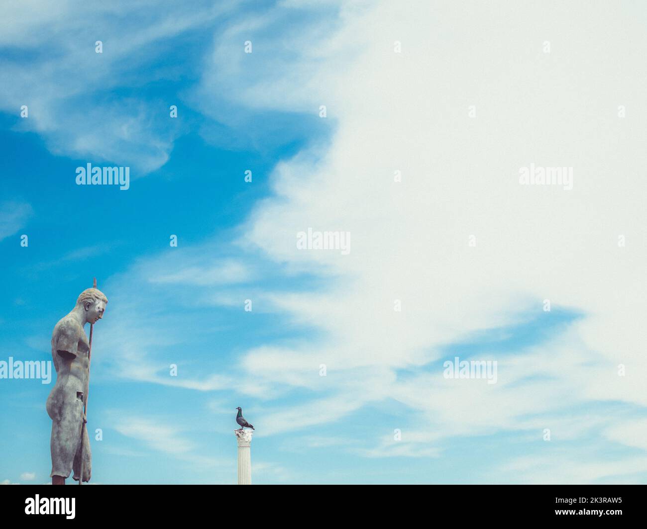 A statue in Pompeii staring at a pigeon Stock Photo - Alamy