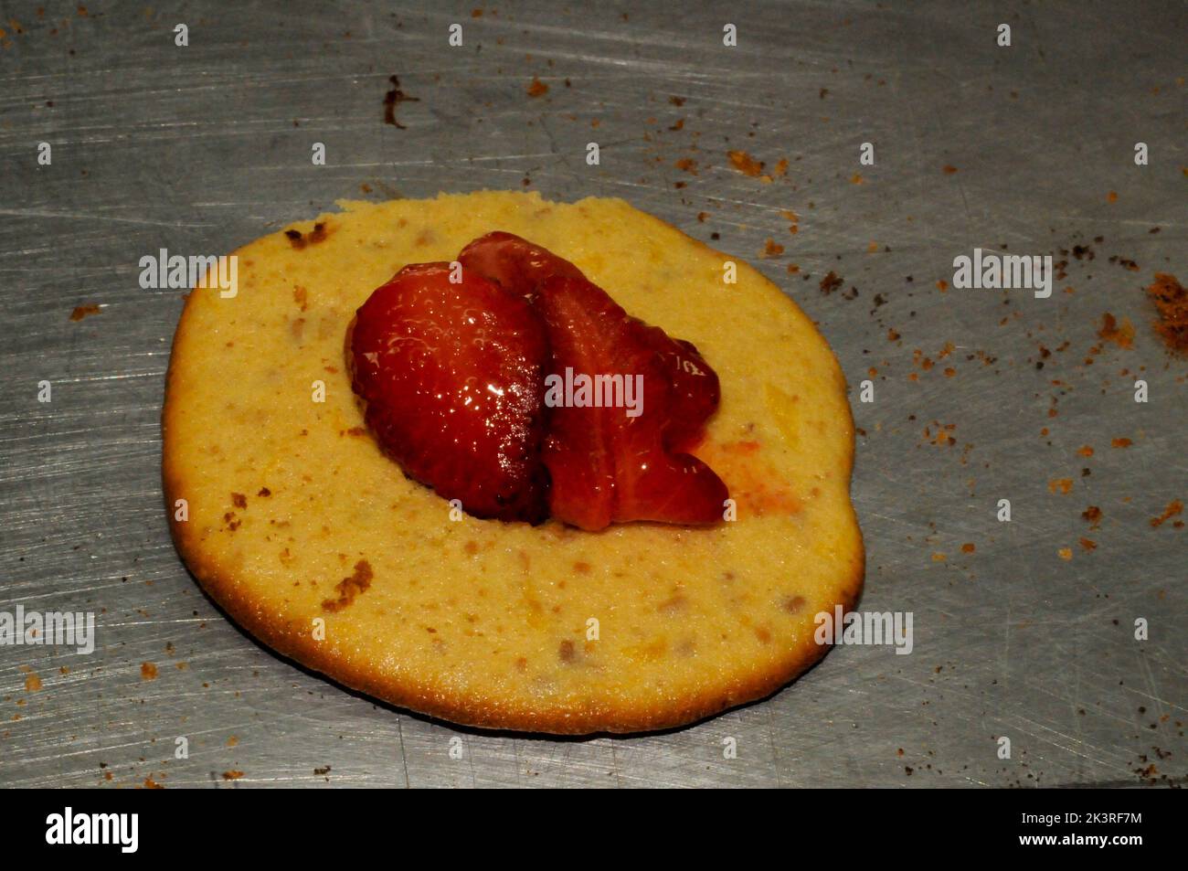 Almond cookies with a jam bath Stock Photo - Alamy