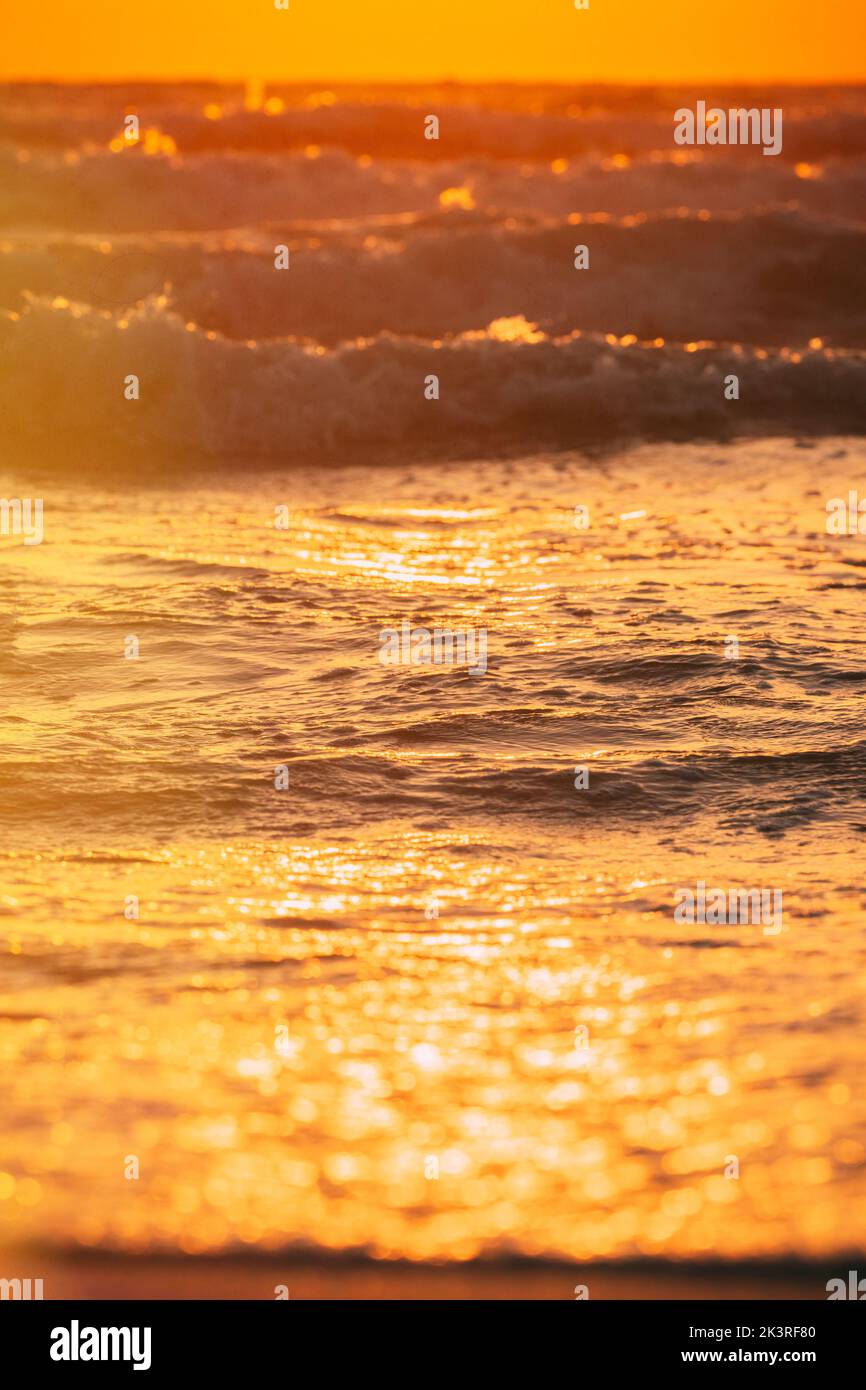 Sunset above sea. Natural sunrise sky warm colors over ripple sea with ...