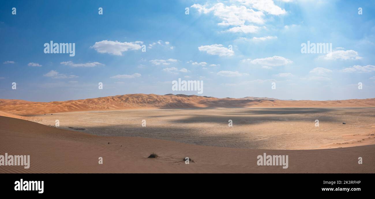 Off-road vehicles driving thru a continental sabkha between high sand ...