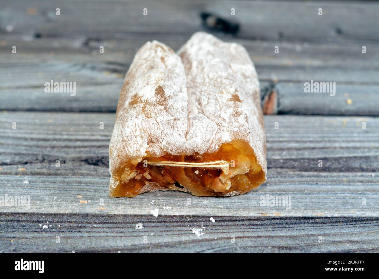 Arabian Egyptian taffy stuffed with walnuts, Eastern candy made as a ...