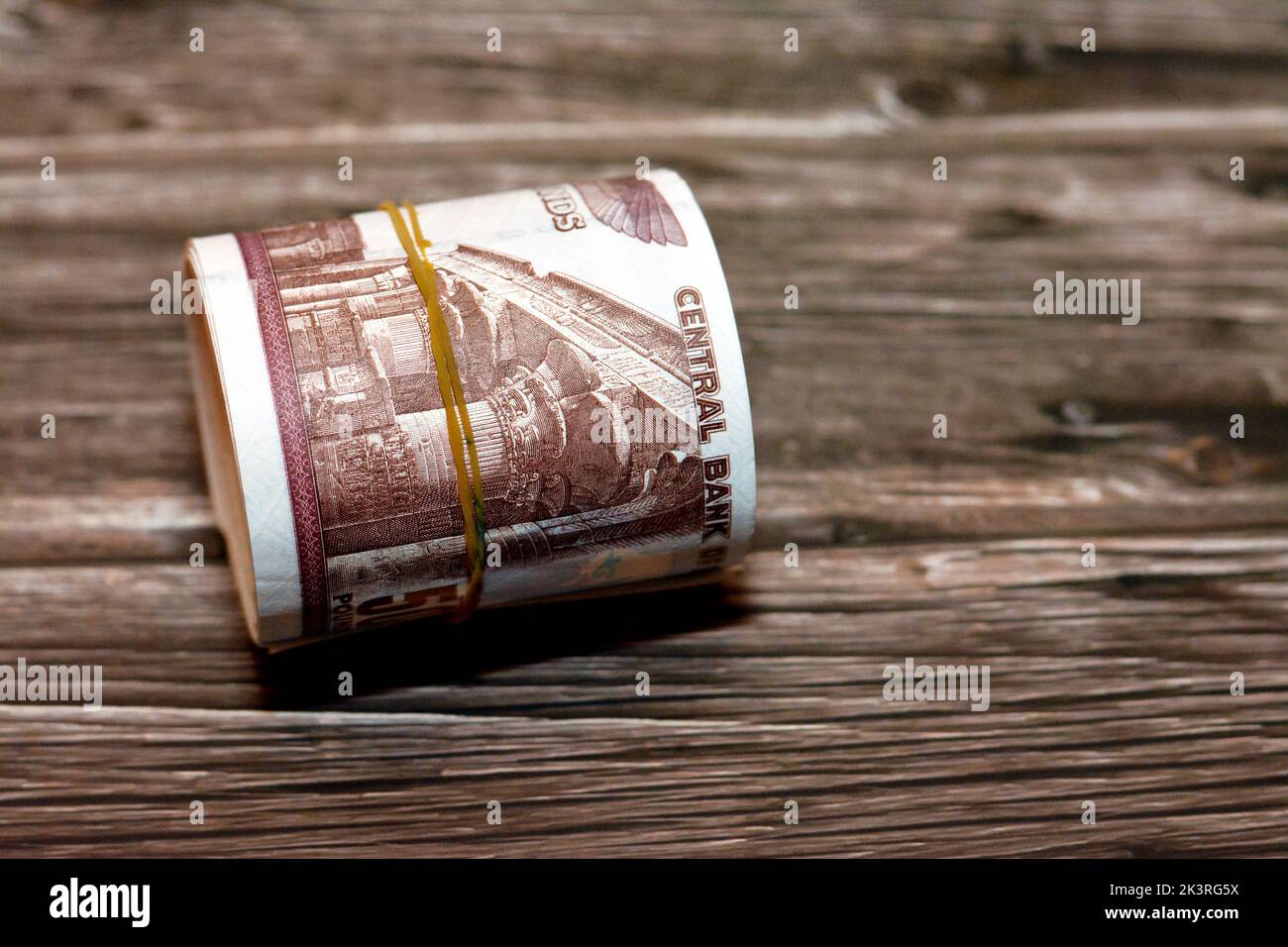 Egypt money roll pounds isolated on wooden background, 50 LE fifty ...