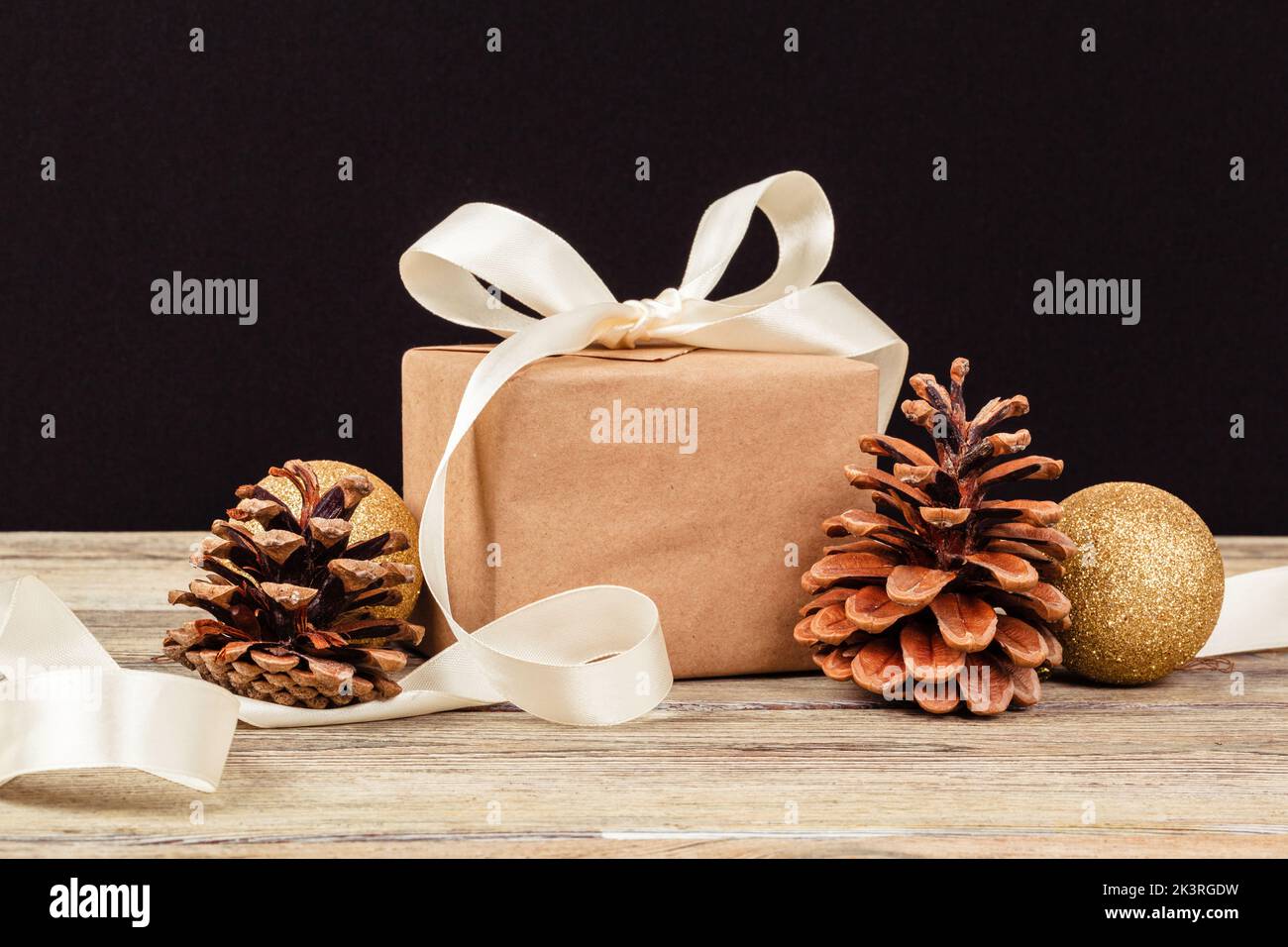 Christmas table decor with a gift box Stock Photo - Alamy