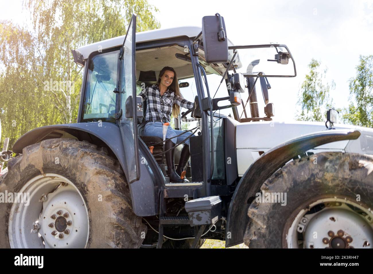 Female driving tractor hi-res stock photography and images - Alamy