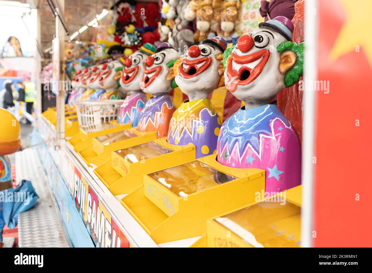 Laughing clowns game attraction at a fair carnival Stock Photo - Alamy