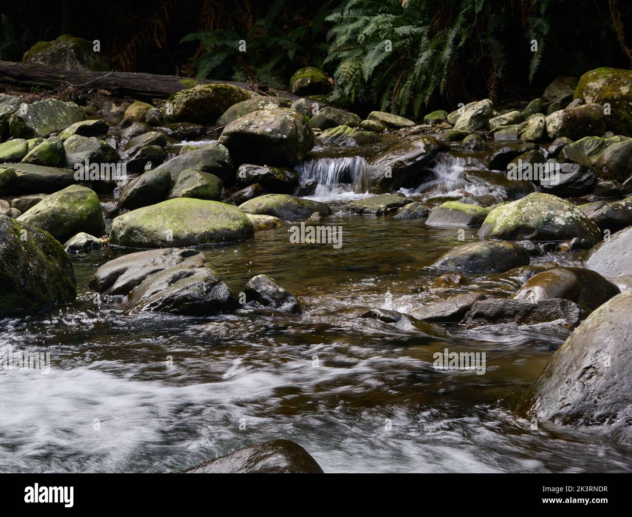 Slow shutter speed smooths the water flowing and cascadinover the rocks ...