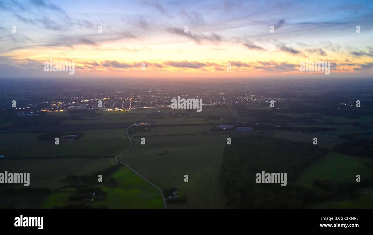 sunset and city lights in denmark Stock Photo - Alamy