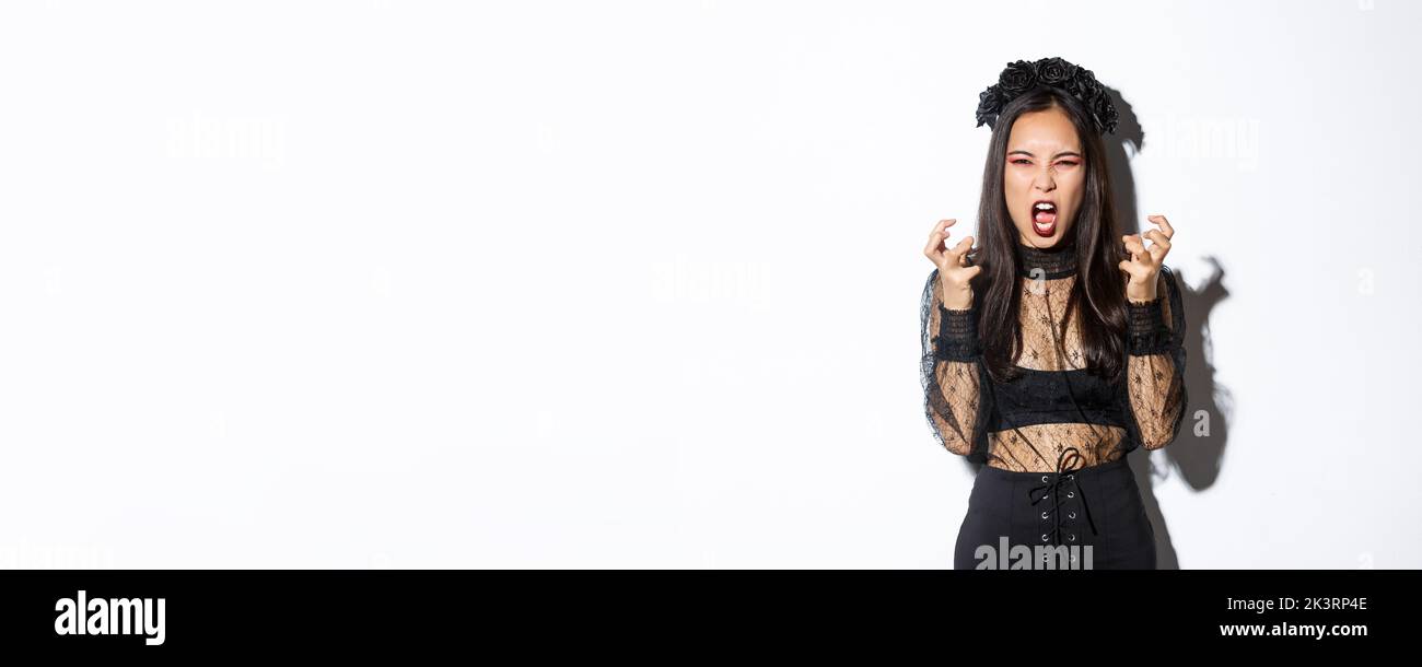 Image of mad woman in gothic lace dress and black wreath yelling angry ...