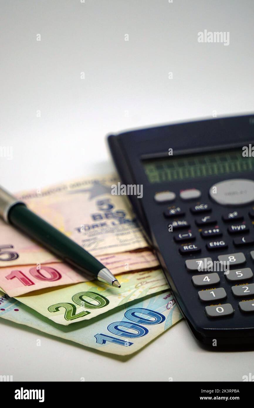 The Turkish lira banknotes and a calculator for calculating the bills ...