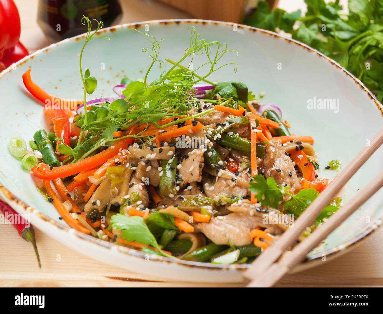 tasty wheat noodles with pork and vegetables. Asian cuisine Stock Photo ...
