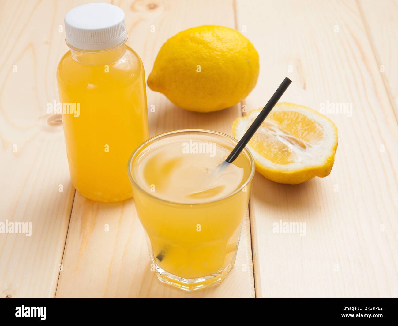 tasty ginger lemonade in a bottle and in a glass. Concept: food ...