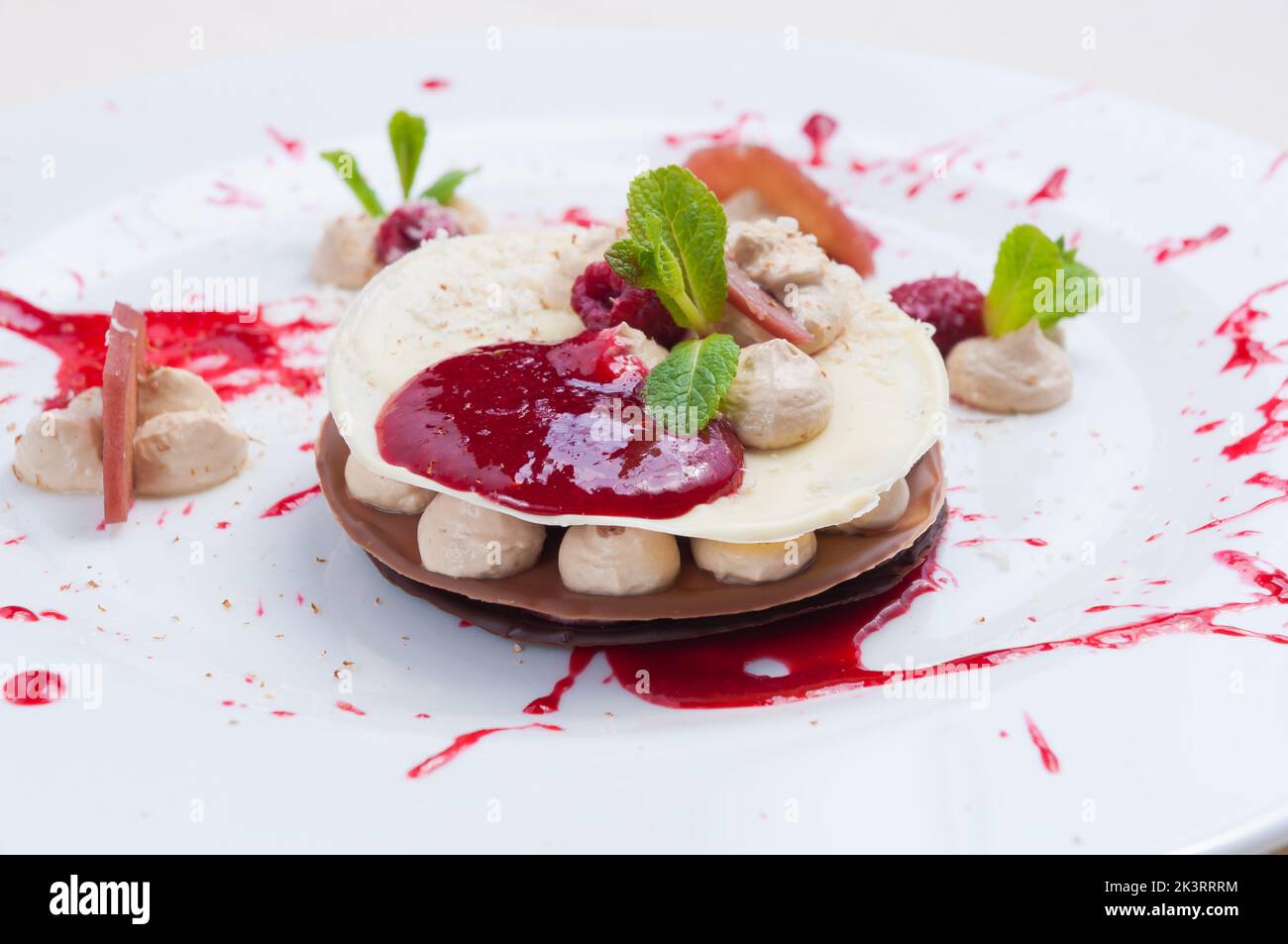 tasty millefeuille with three types of chocolate, pureed raspberries ...