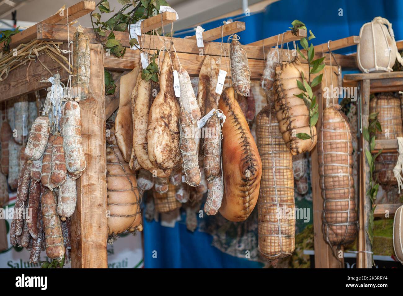 A rich variety of typical cured meats exhibited at the Salone del Gusto ...