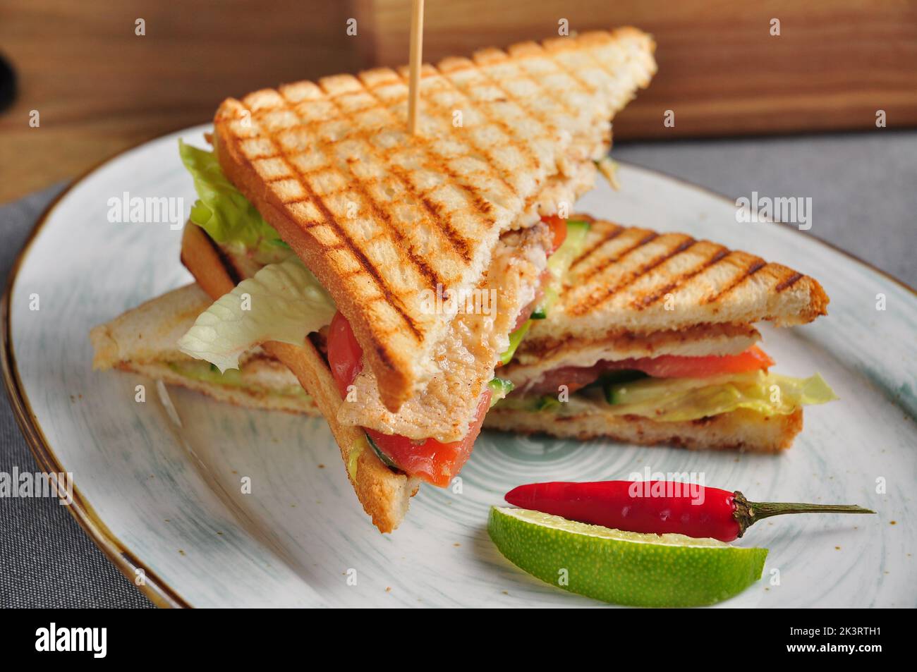 toasted toast with chicken fillet and vegetables Stock Photo - Alamy