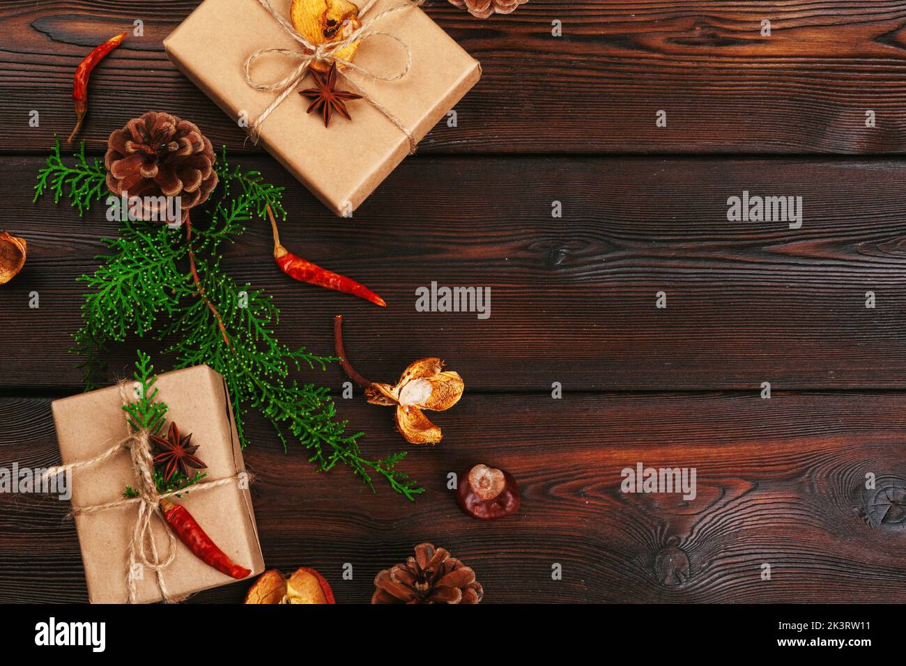 Christmas composition. Christmas gift, knitted blanket, pine cones, fir ...