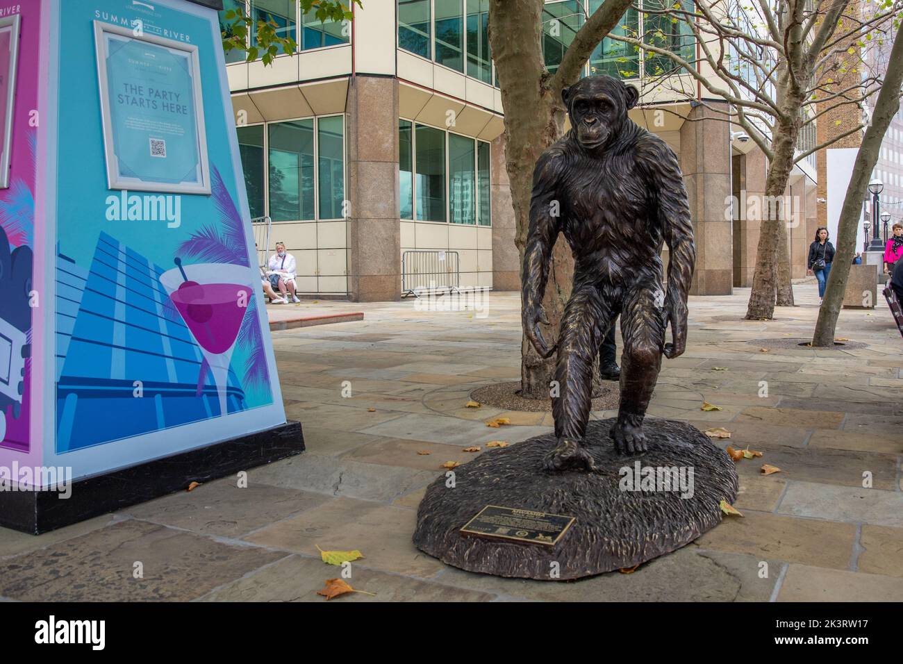 A sculpture of a chimpanzee standing from the Chimps are Family ...