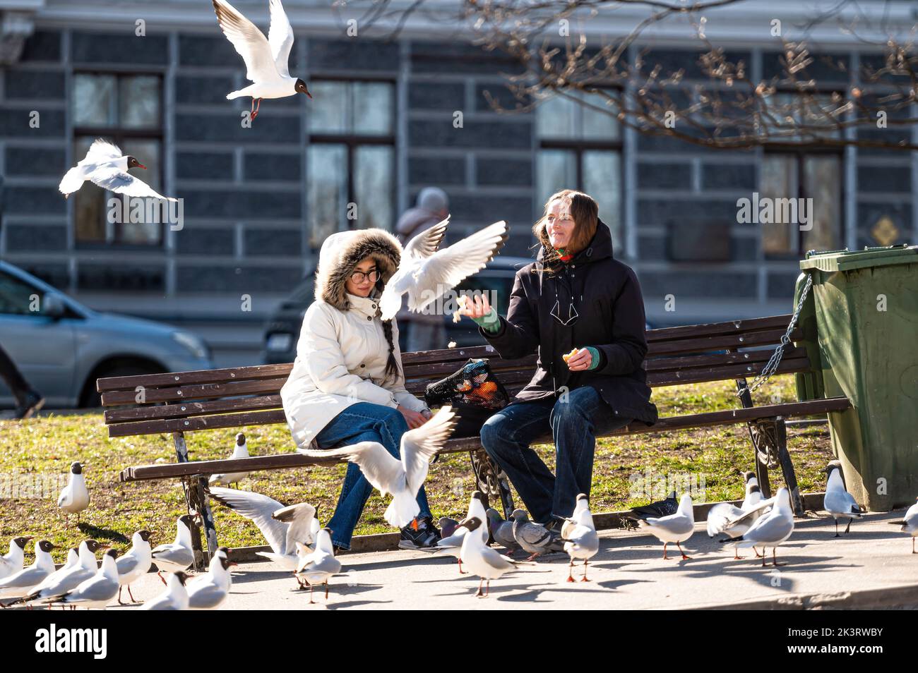 Riga, Latvia - April 2, 2022: People enjoy the first warm days of ...