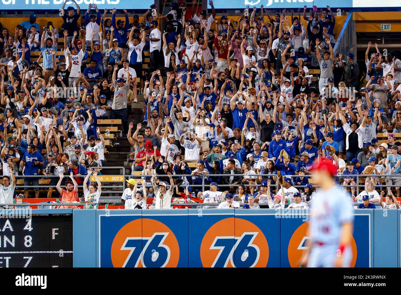 Los Angeles Dodgers fans are seen doing the wave in the crowd during a ...
