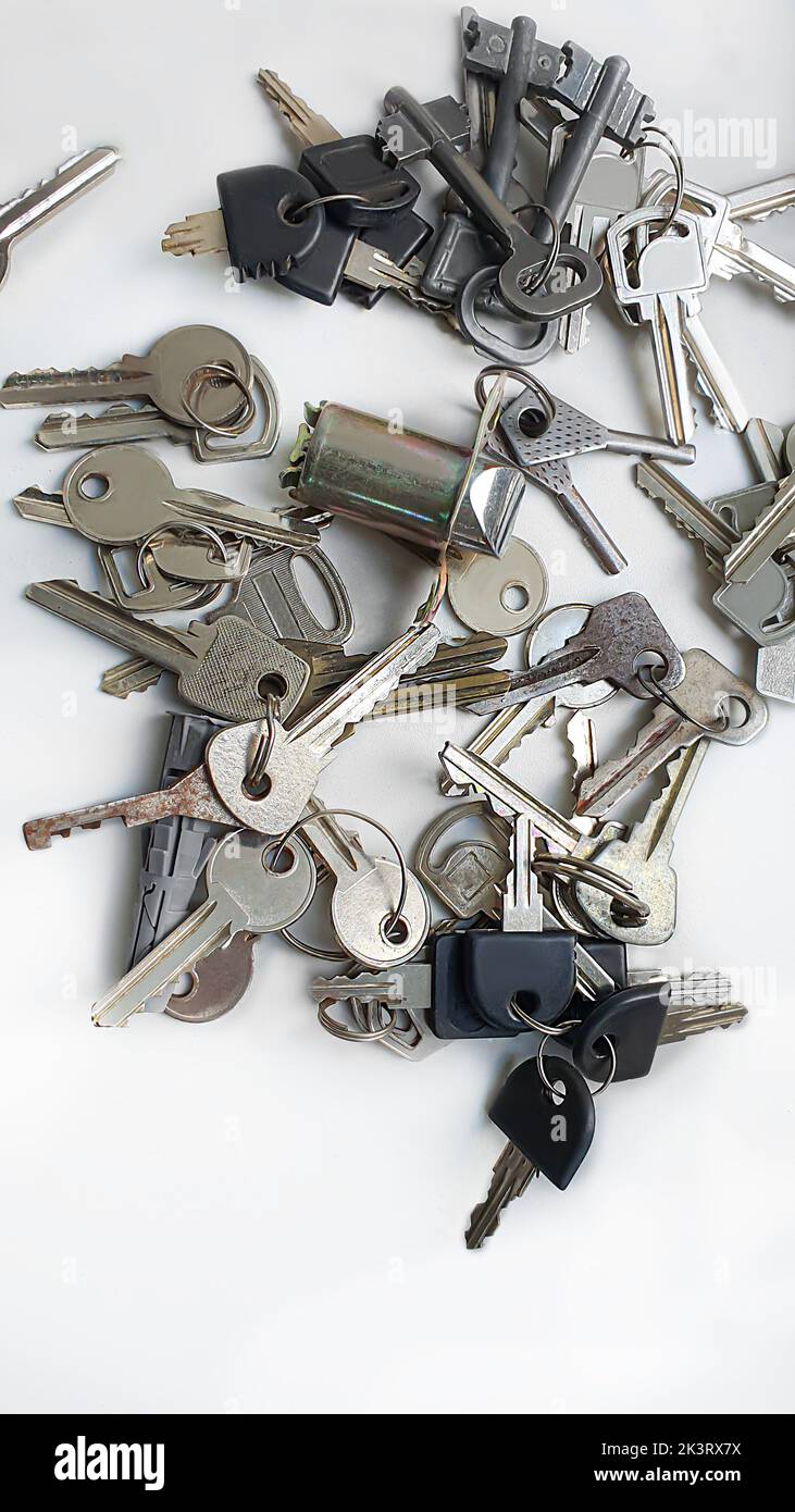 Pile of old keys. Open locks. Plastic and iron. copy space Stock Photo ...