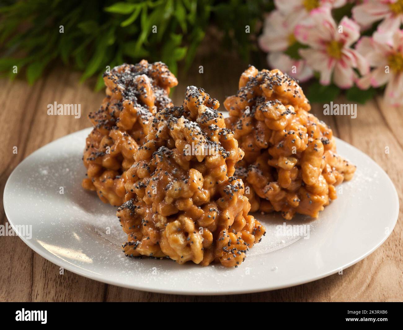 tasty ant cake decorated with poppy seeds on a white plate Stock Photo ...