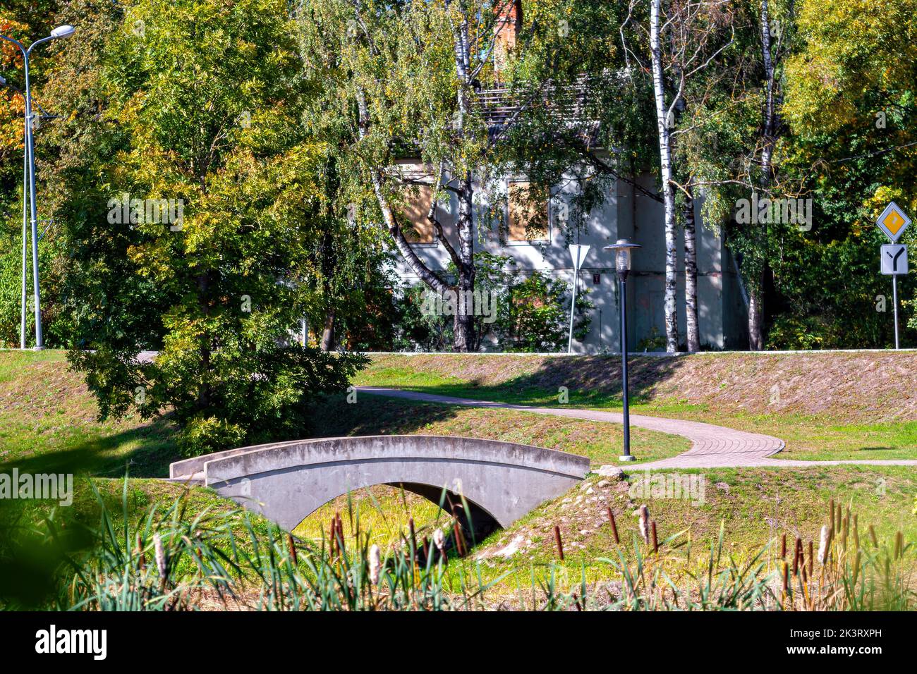 small town landscape with pedestrian bridge and paved walkway Stock ...