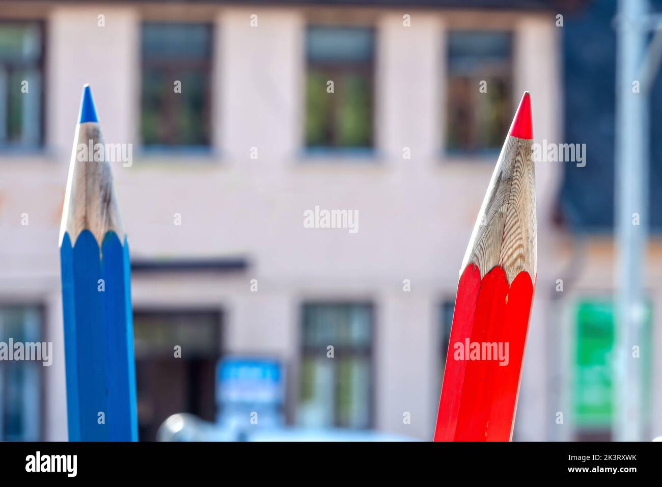 large decorative colored wooden pencils on defocused background, back ...