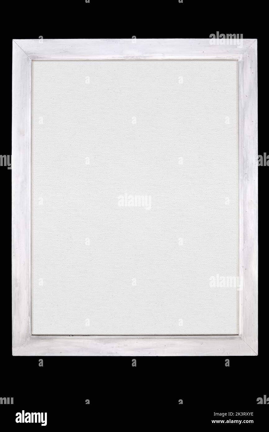 White wooden painted frame with white blank canvas isolated on black ...