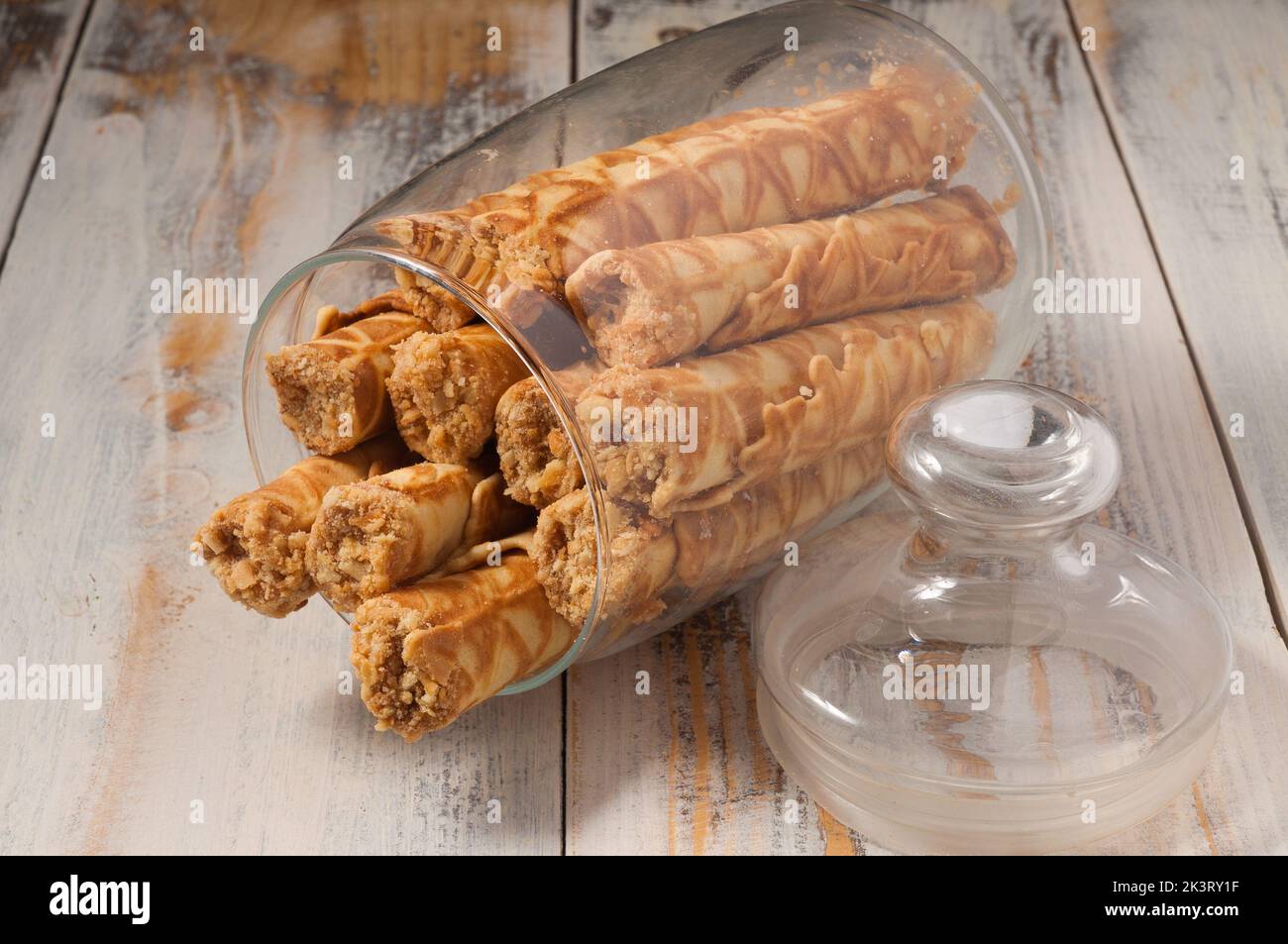 sweet tubes with boiled condensed milk in a glass container Stock Photo ...
