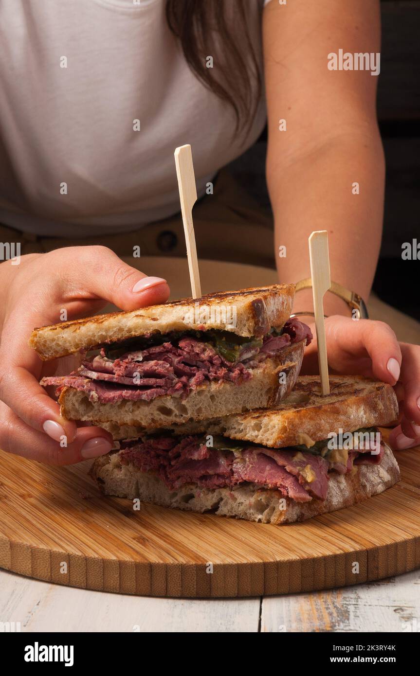 Hands holding big hamburger hi-res stock photography and images - Alamy