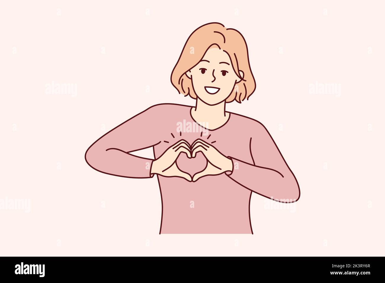 Smiling young woman show heart hand gesture at heart share care and ...