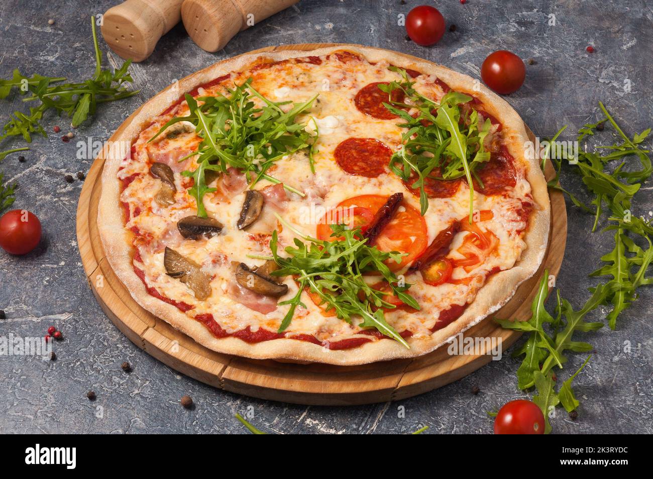tasty assorted pizza with different fillings: salami, tomatoes ...