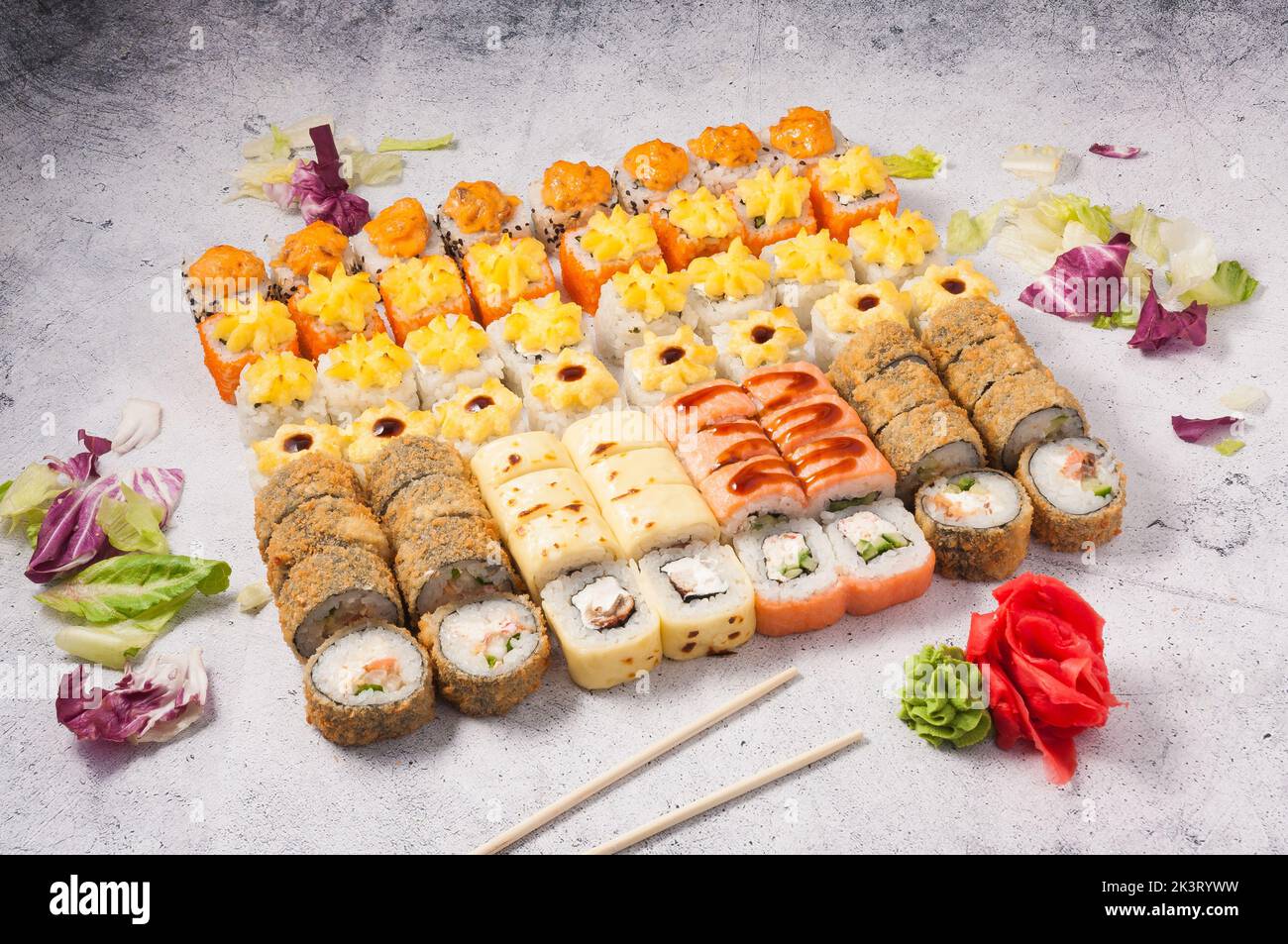 set of tasty sushi rolls on a gray background Stock Photo - Alamy
