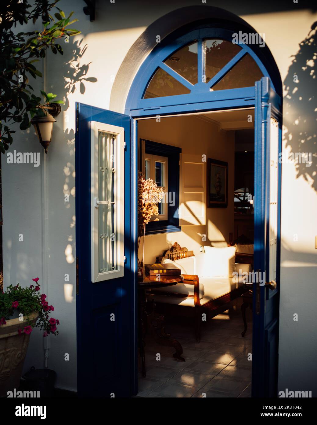 An open blue door heading to the interiors of a modern house Stock ...
